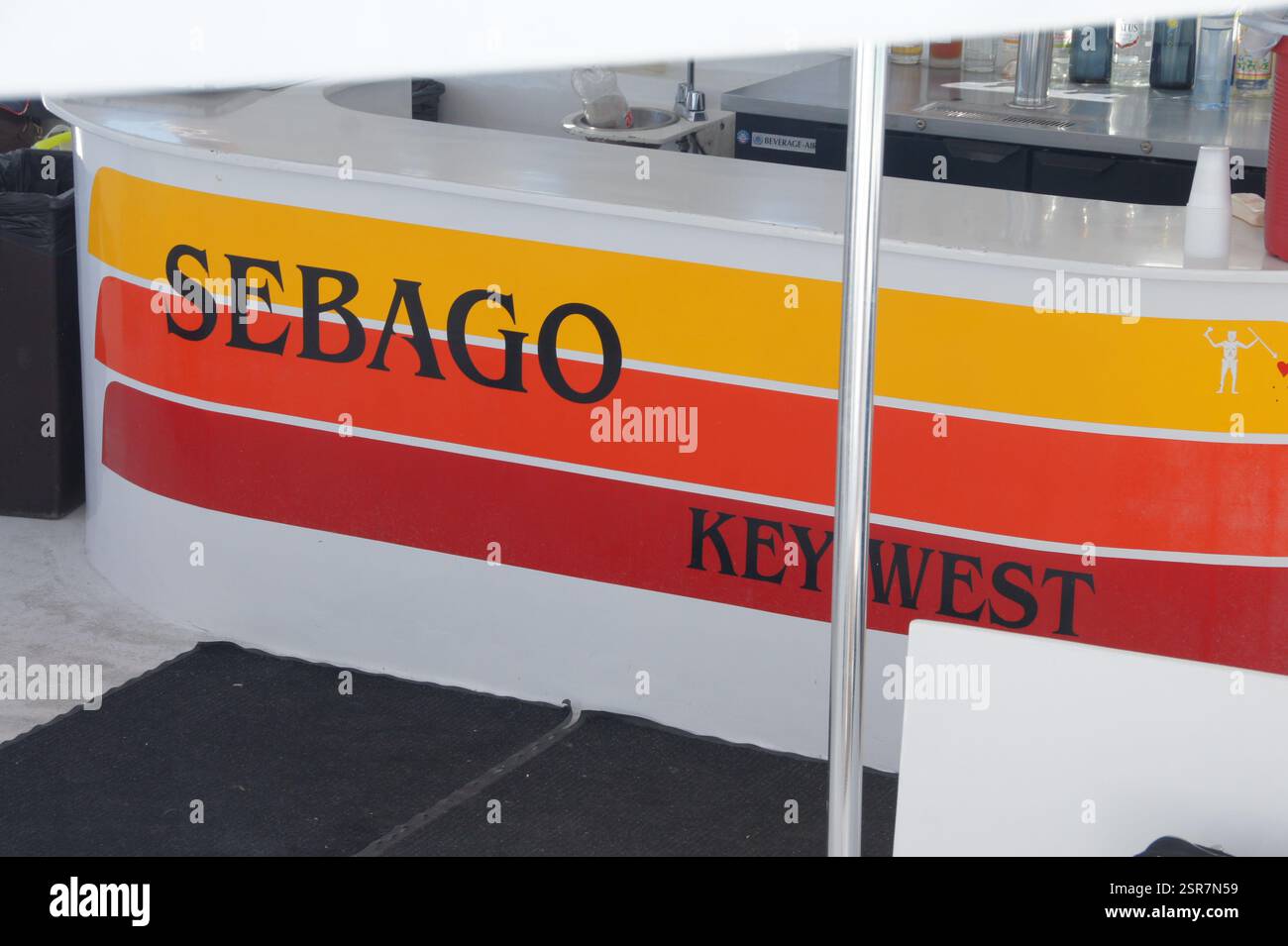 Bar counter prominently displays the Sebago Key West logo. Nautical ...