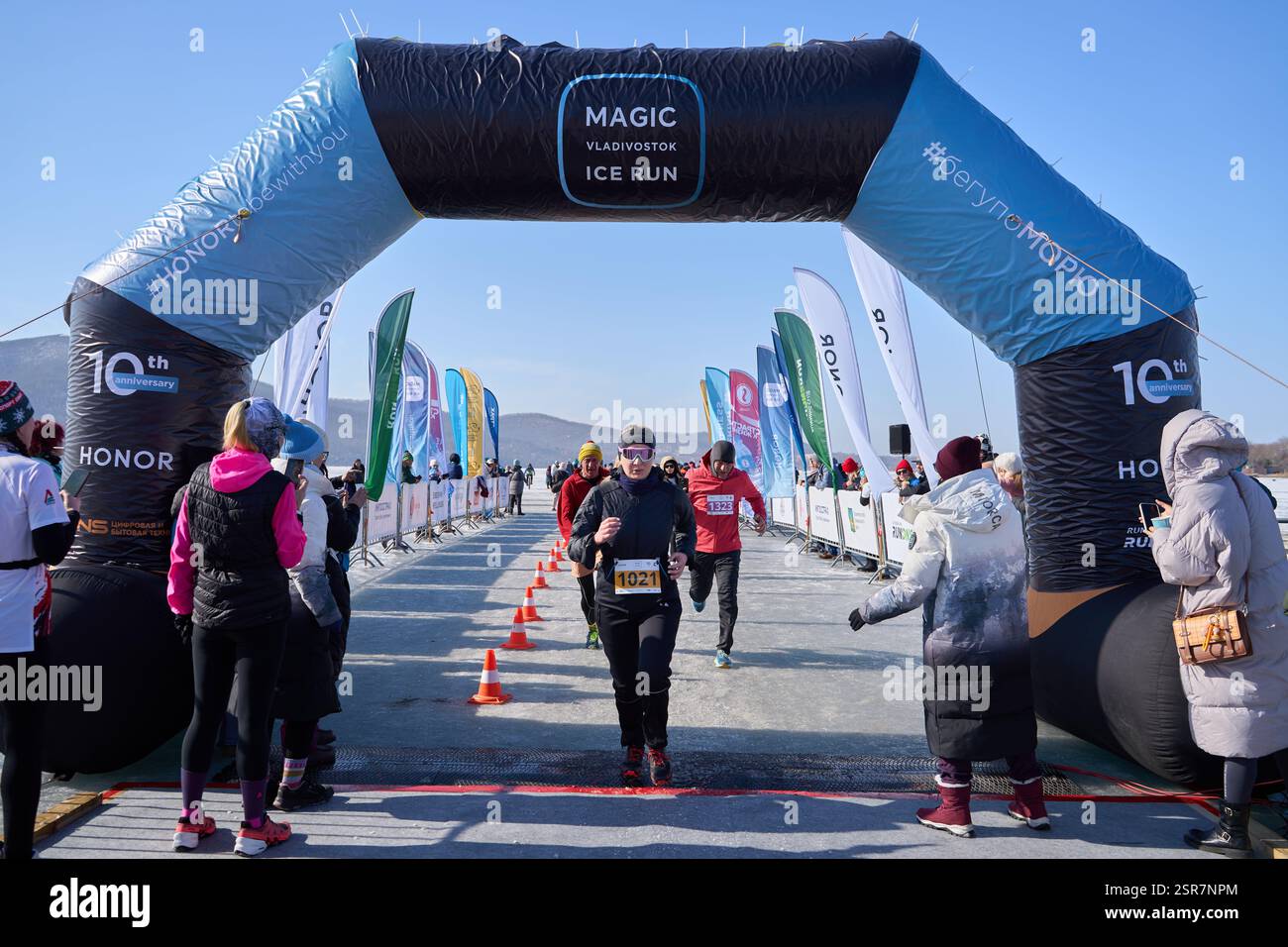 Vladivostok, Russia. 15th Feb, 2025. Runners reach the finish line ...