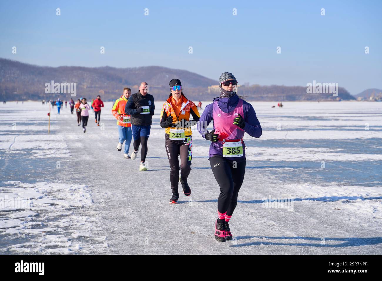 Vladivostok, Russia. 15th Feb, 2025. Runners participate in the "Ice ...