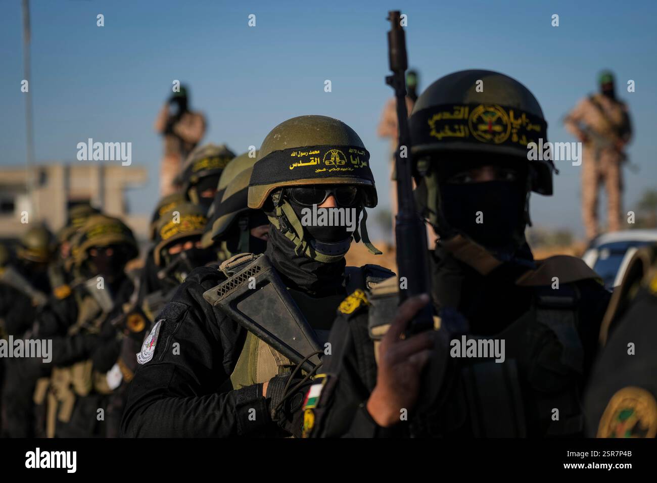 Islamic Jihad fighters take up a position ahead of a hostages release ...