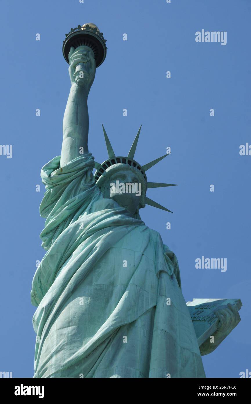 Close-up of New York's Statue of Liberty's crown. Sun rays pierce ...