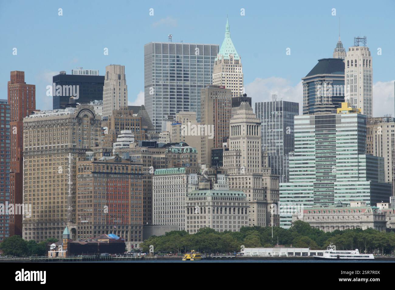 New York City panorama from Liberty Island. Towering skyscrapers rise ...