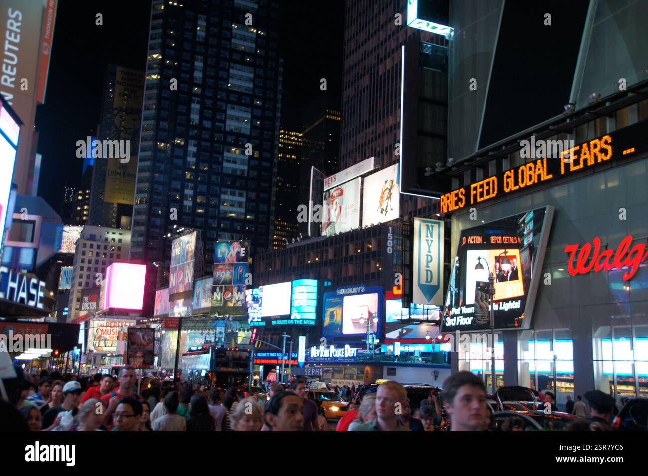 A building in New York, Manhattan's Times Square displays a vibrant mix ...