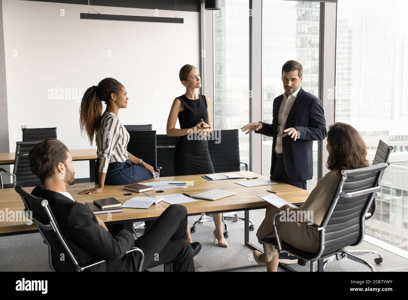 Male boss leading conversation, presenting ideas, share strategy during ...