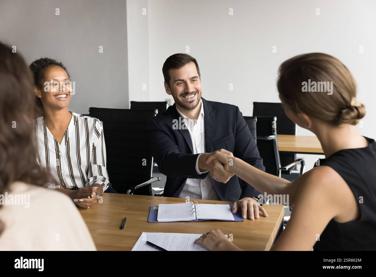 Boss shaking hands employee as acknowledgement of job well done Stock ...