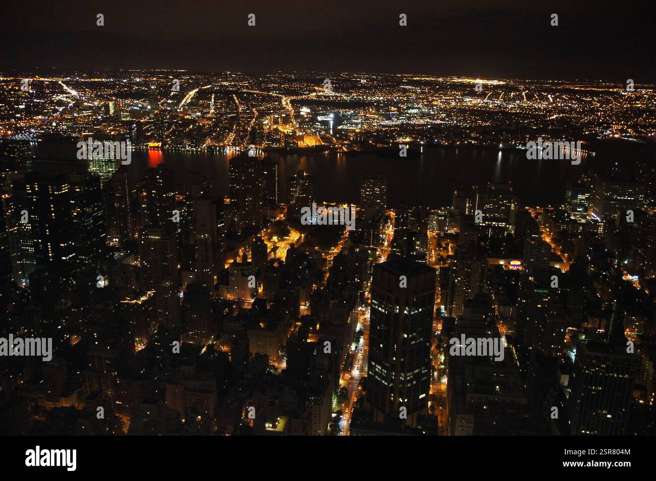 New York, Manhattan emerges from the darkness in a dazzling display of ...
