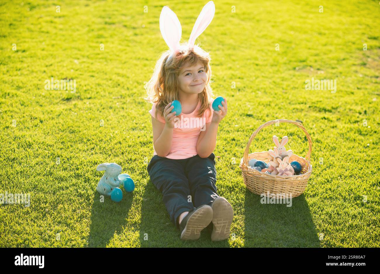 Children celebrating easter. Kid in rabbit costume with bunny ears ...