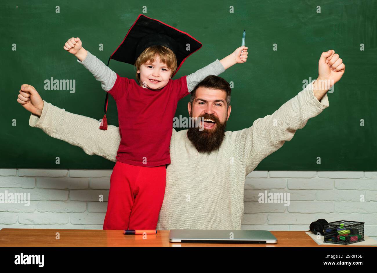 Elementary school teacher and student in classroom. Yay. Smiling ...