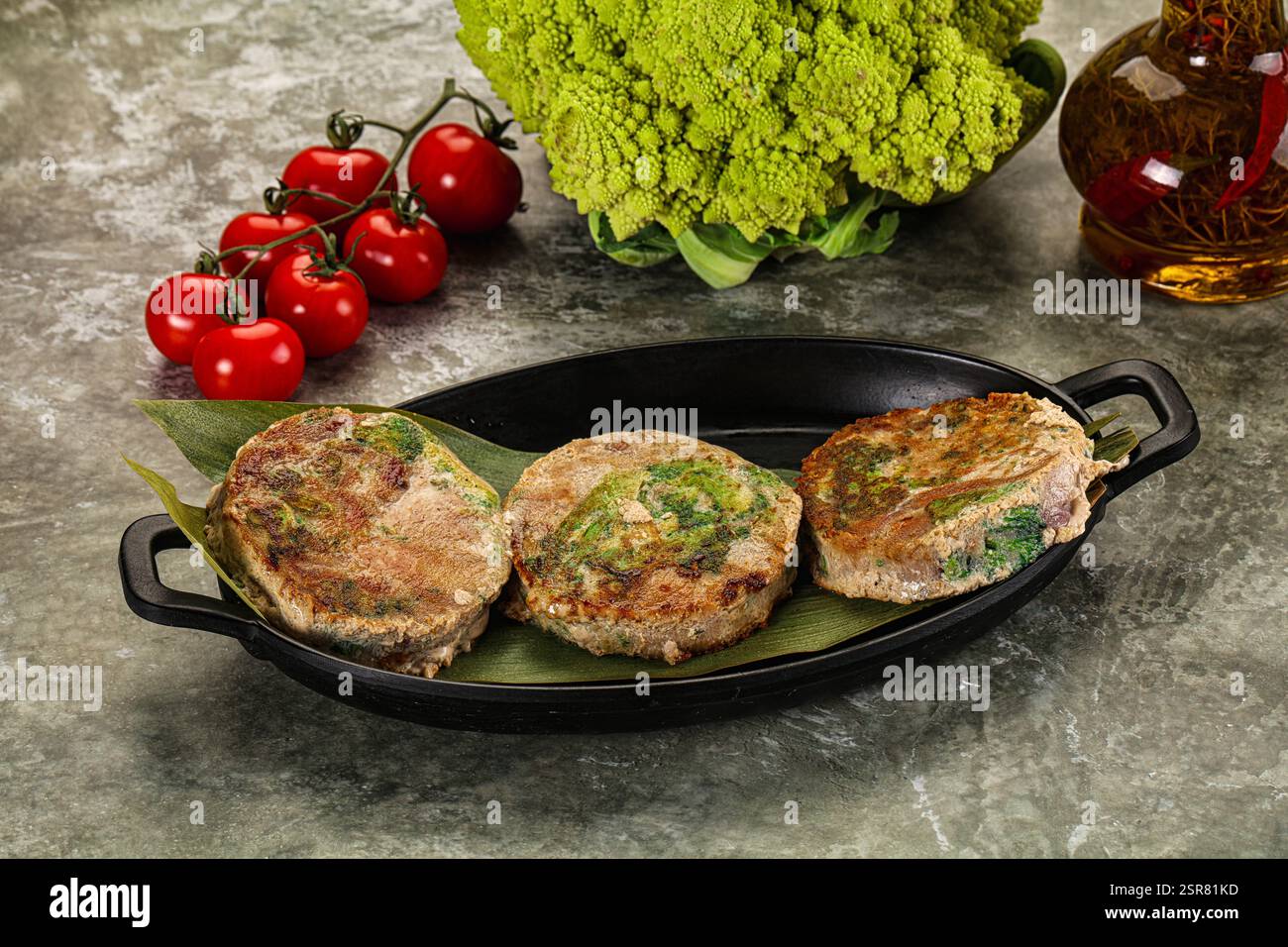 Roasted tuna medallion with broccoli cabbage Stock Photo - Alamy