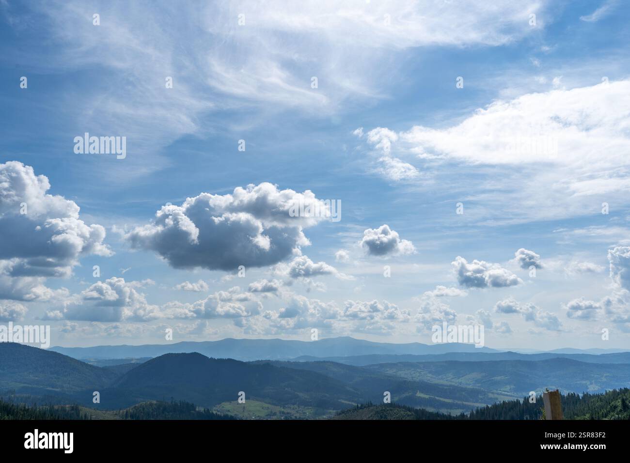 Sky over Mountains ranges. Green forest Nature Stock Photo - Alamy