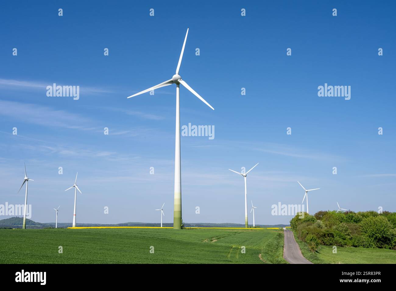 Modern wind energy plants with green fields seen in Germany Stock Photo - Alamy