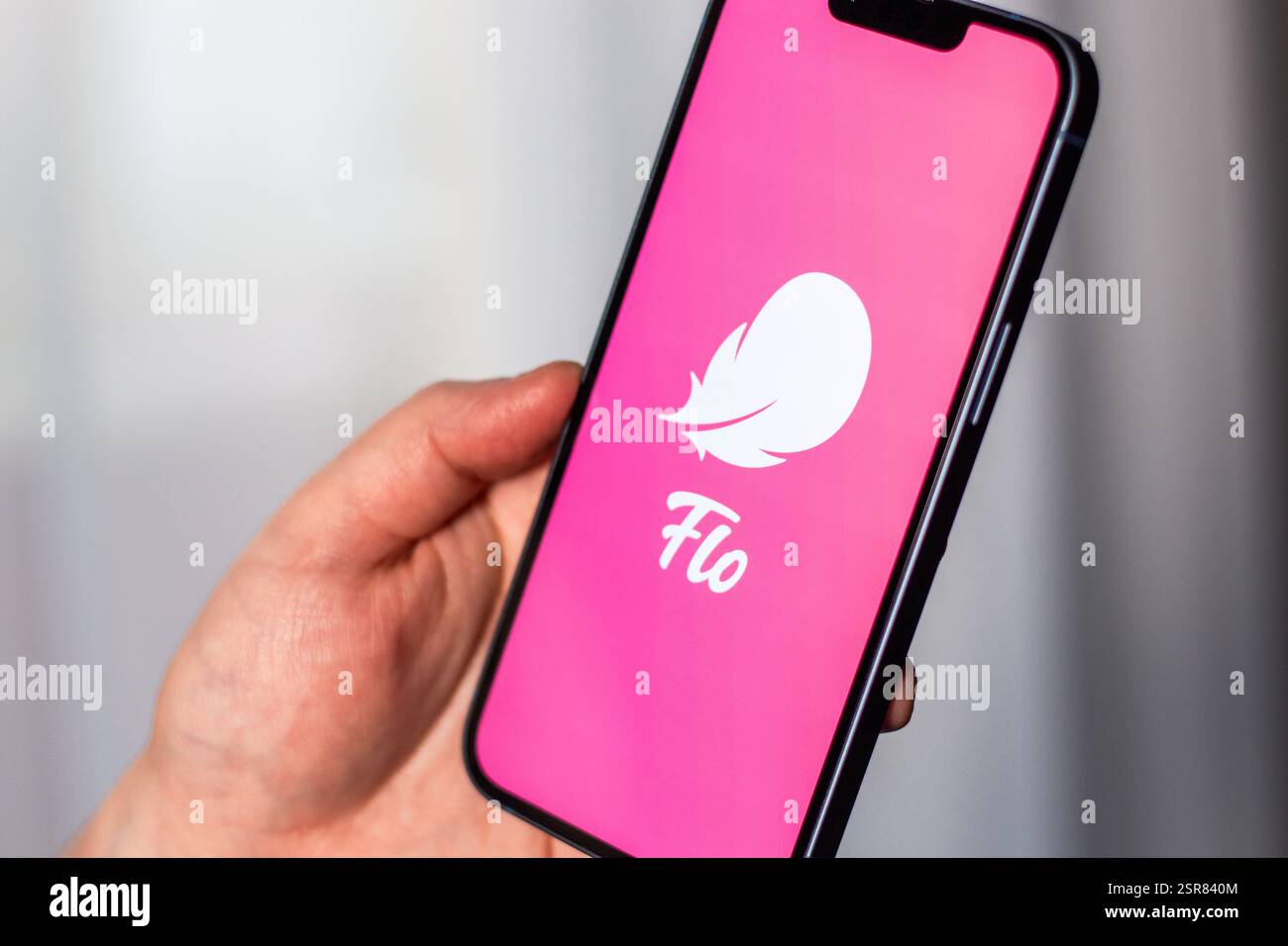 Kaliningrad, Russia 14.01.25 - Woman holding smartphone with FLO ...