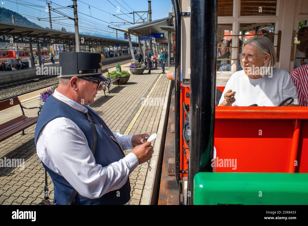 Train with tourists on station at Jenbach station, Tirol, Austria ...
