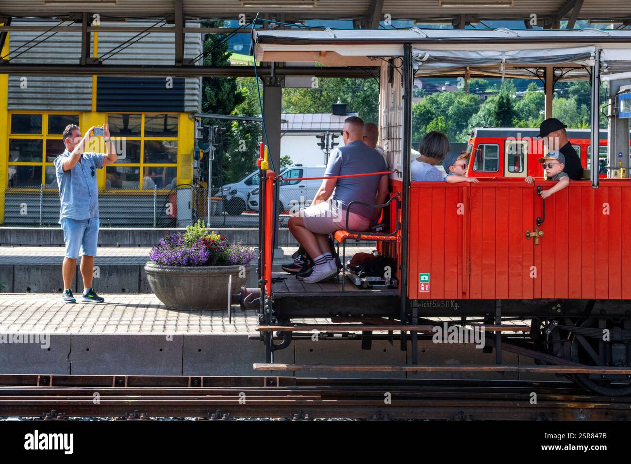 Train with tourists on station at Jenbach station, Tirol, Austria ...