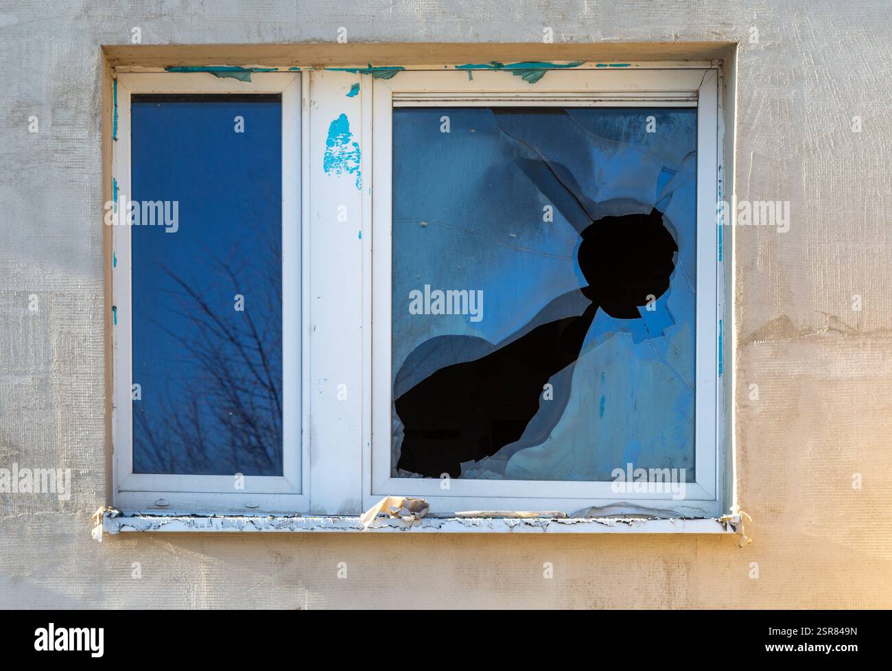 facade of old prefabricated DDR architecture with destroyed window ...