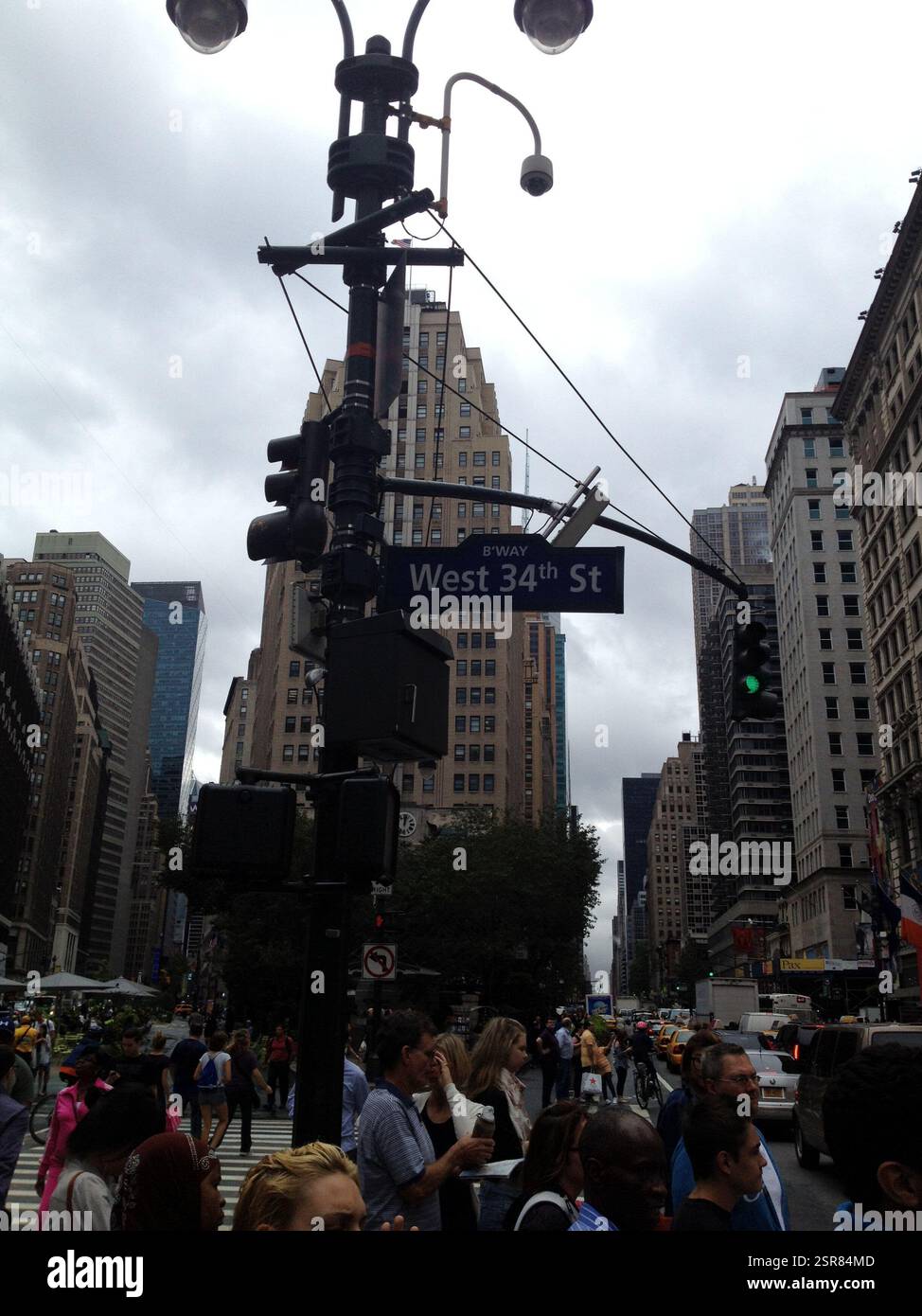 A New York, Manhattan street sign reading B'WAY and West 34th St. This ...