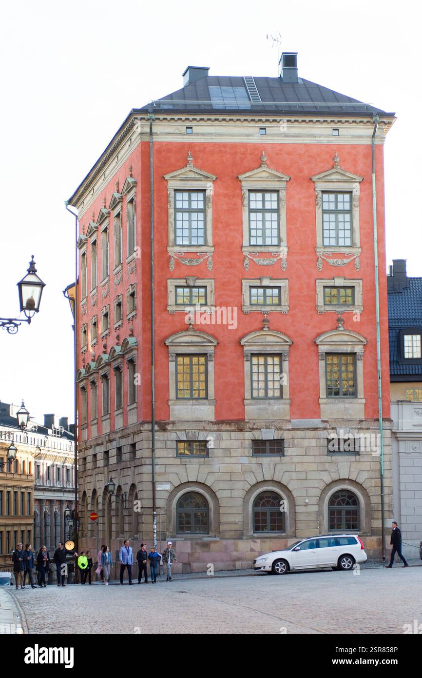 A historic red building in Stockholm, Sweden, with ornate architectural ...