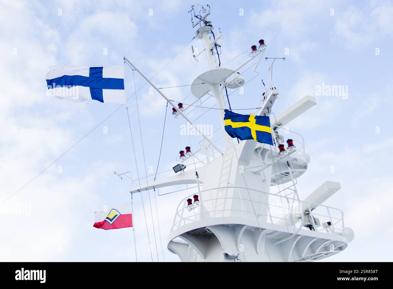 Flags of Finland and Sweden flying on a ship's mast, symbolizing ...