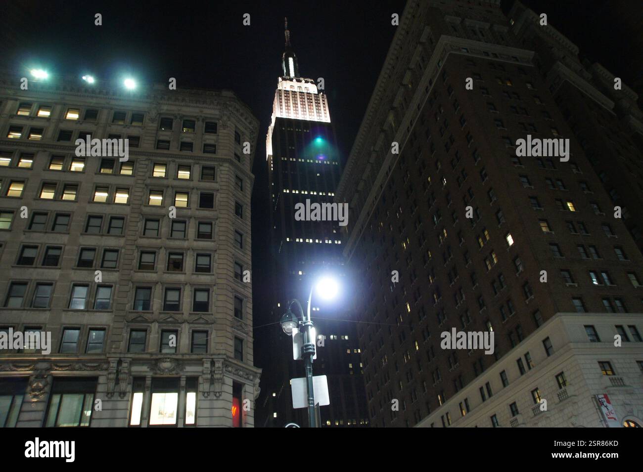 Sparkling skyscrapers pierce the New York, Manhattan night sky. The ...