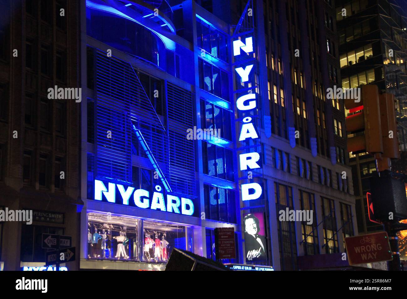 Illuminated skyscrapers with blue neon signs bathe Times Square, New ...