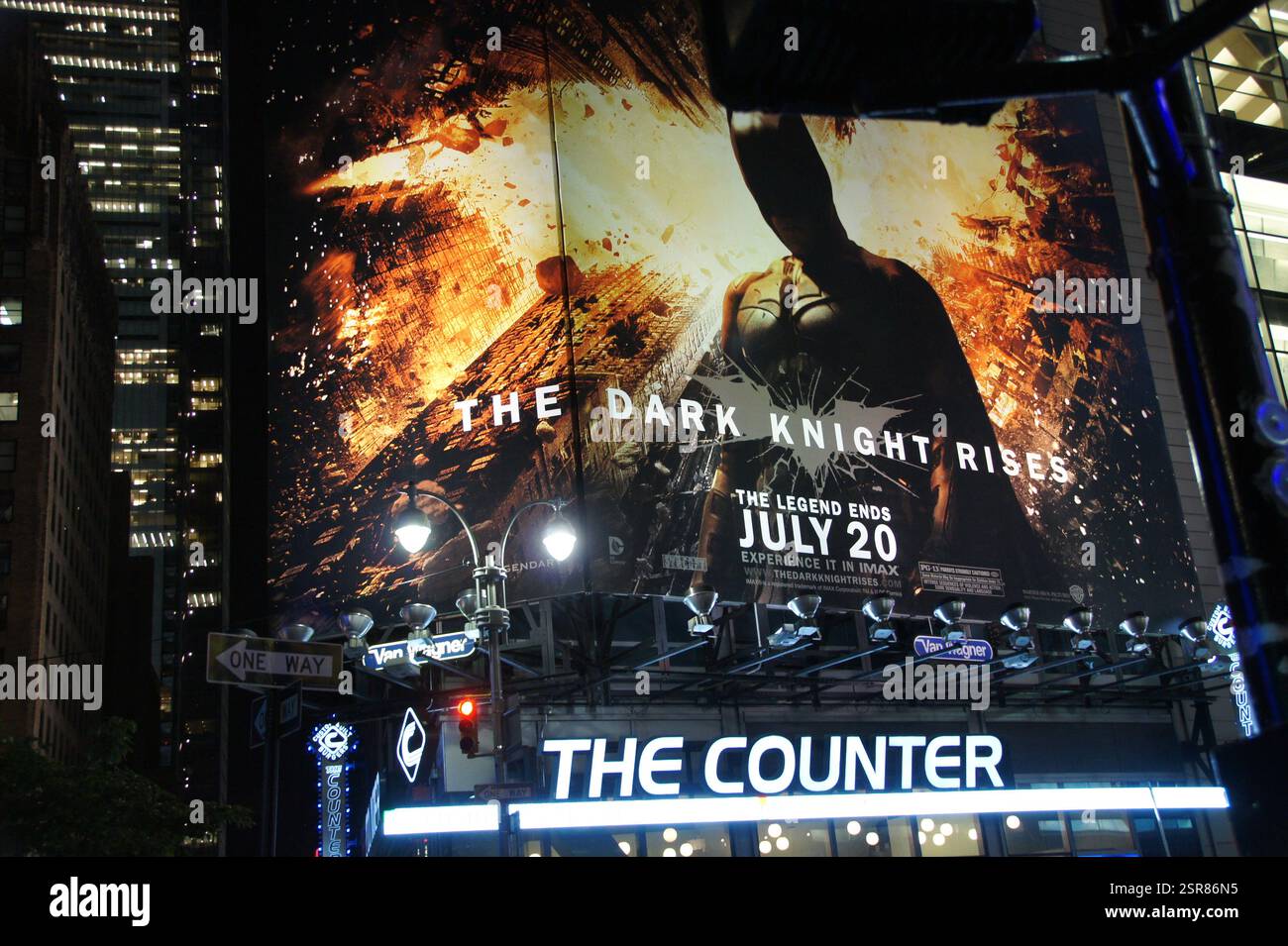 Manhattan's shadows stir. A "Dark Knight Rises" poster blazes in Times ...