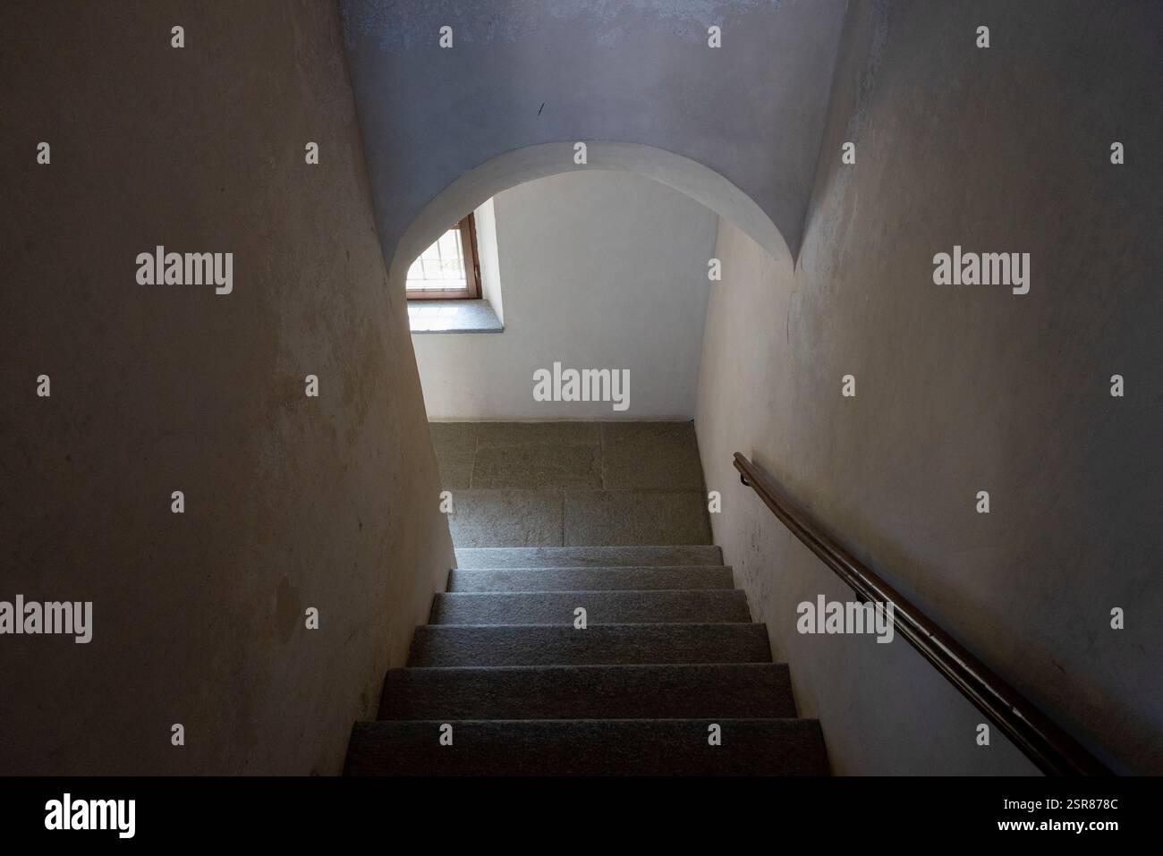 Interior, ancient staircase leading down to the window from which the ...