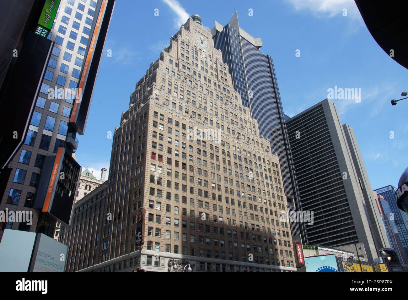 An Art Deco skyscraper with a clock tower presides over New York, Manhattan. The Paramount ...