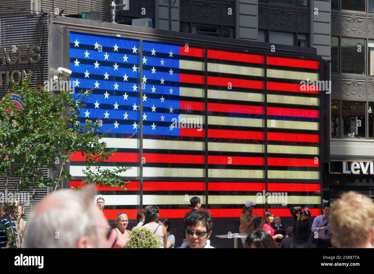 A large video display in Times Square, New York, Manhattan, pulsates ...