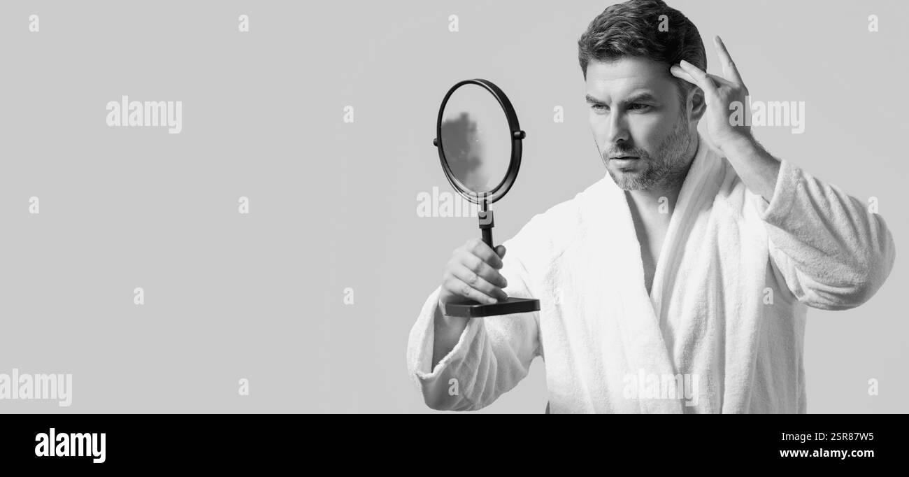 Banner with copy space of man touching chin and skin. Handsome man ...