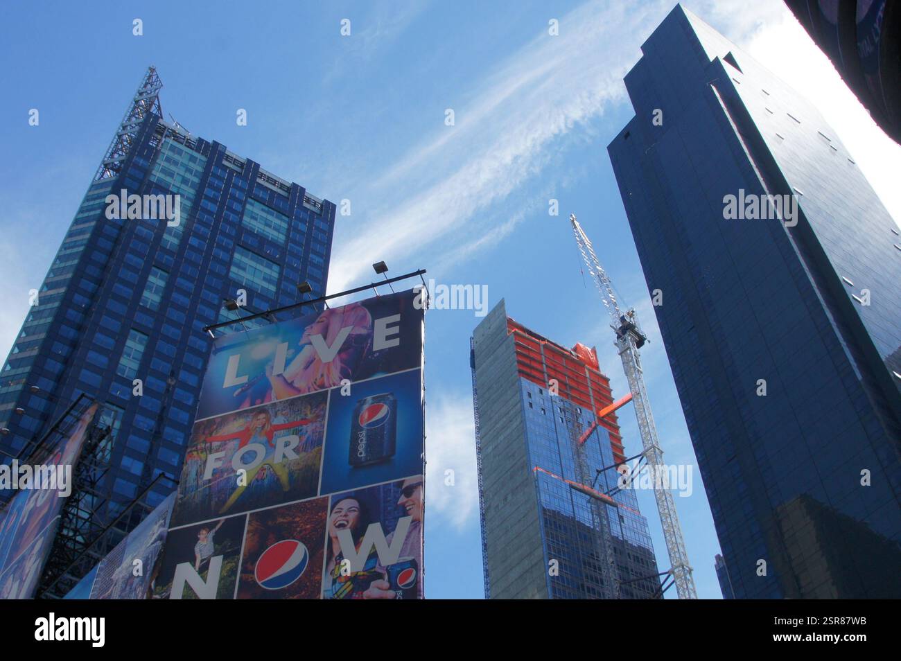A giant Pepsi ad lights up Times Square, New York City. Skyscrapers ...