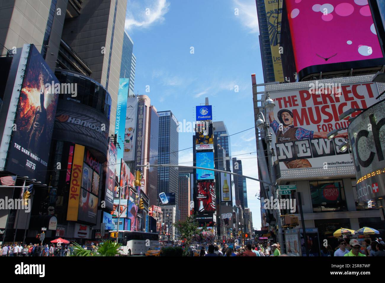 In a brightly lit New York, Manhattan intersection, a Times Square ...
