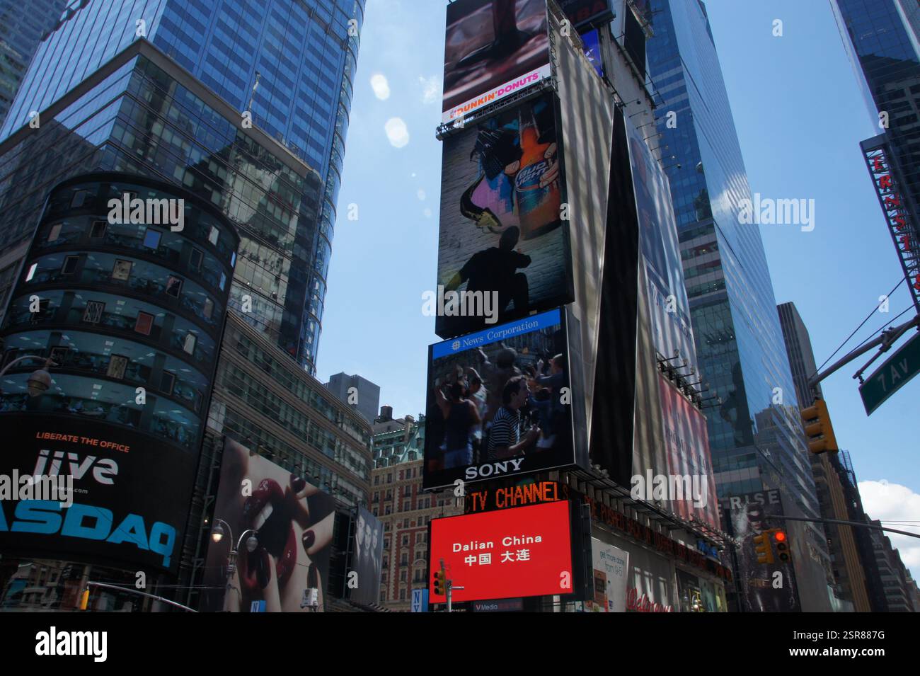 A dazzling display of advertisements fills a large billboard in New ...
