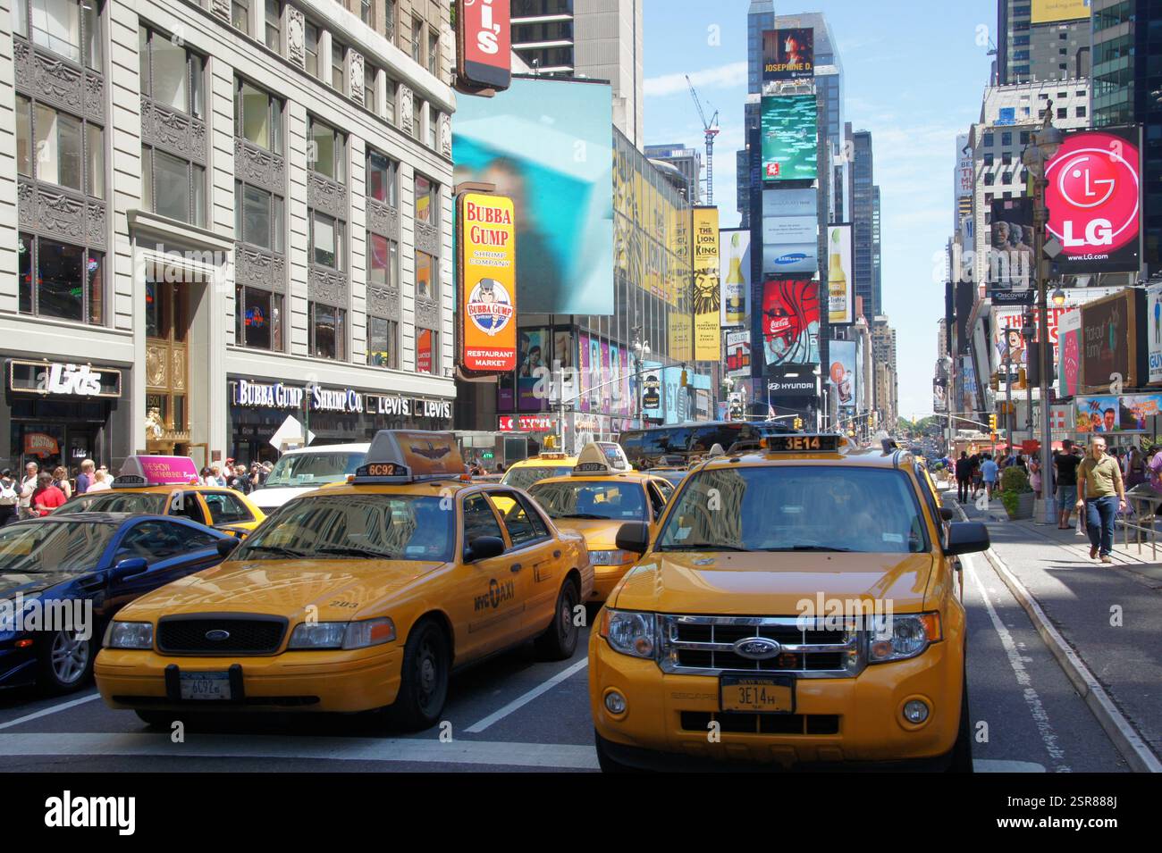 A storefront window in Times Square displays advertisements for Bubba ...