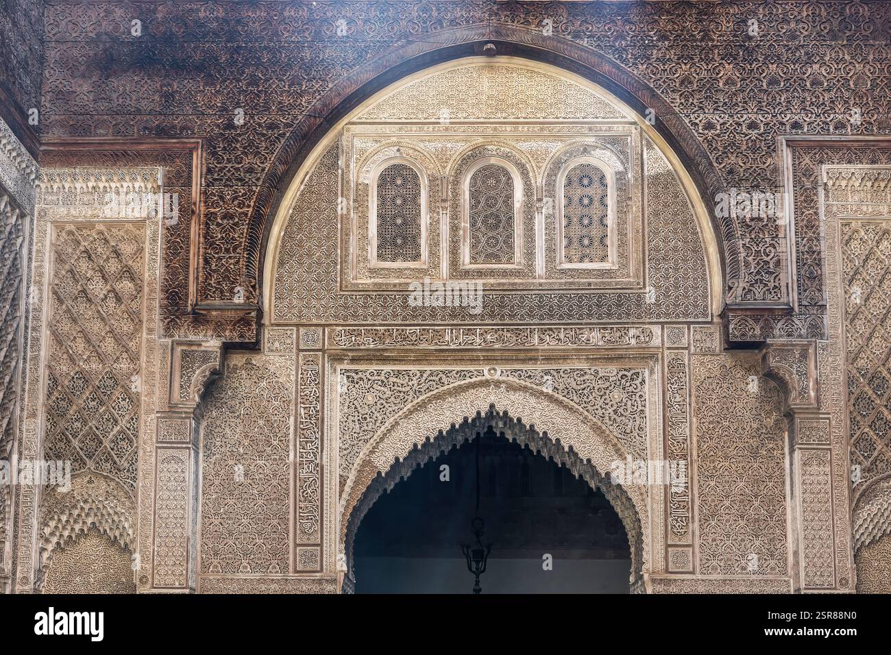 Beautiful sunlit decoration in Al-Attarine Madrasa in Fes, Morocco ...