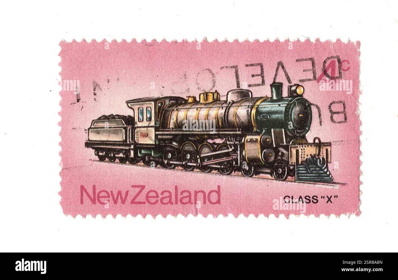 A vintage railway engine postage stamp from New Zealand isolated on a ...