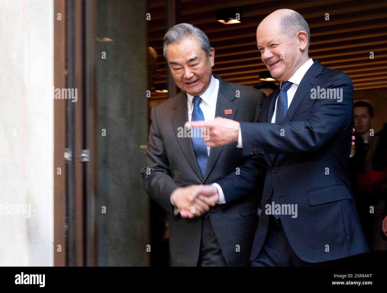 Germany's Chancellor Olaf Scholz, right, and Foreign Minister of China ...