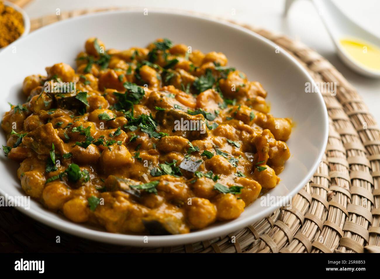 Chickpea curry with eggplant, a traditional Indian vegan recipe Stock ...