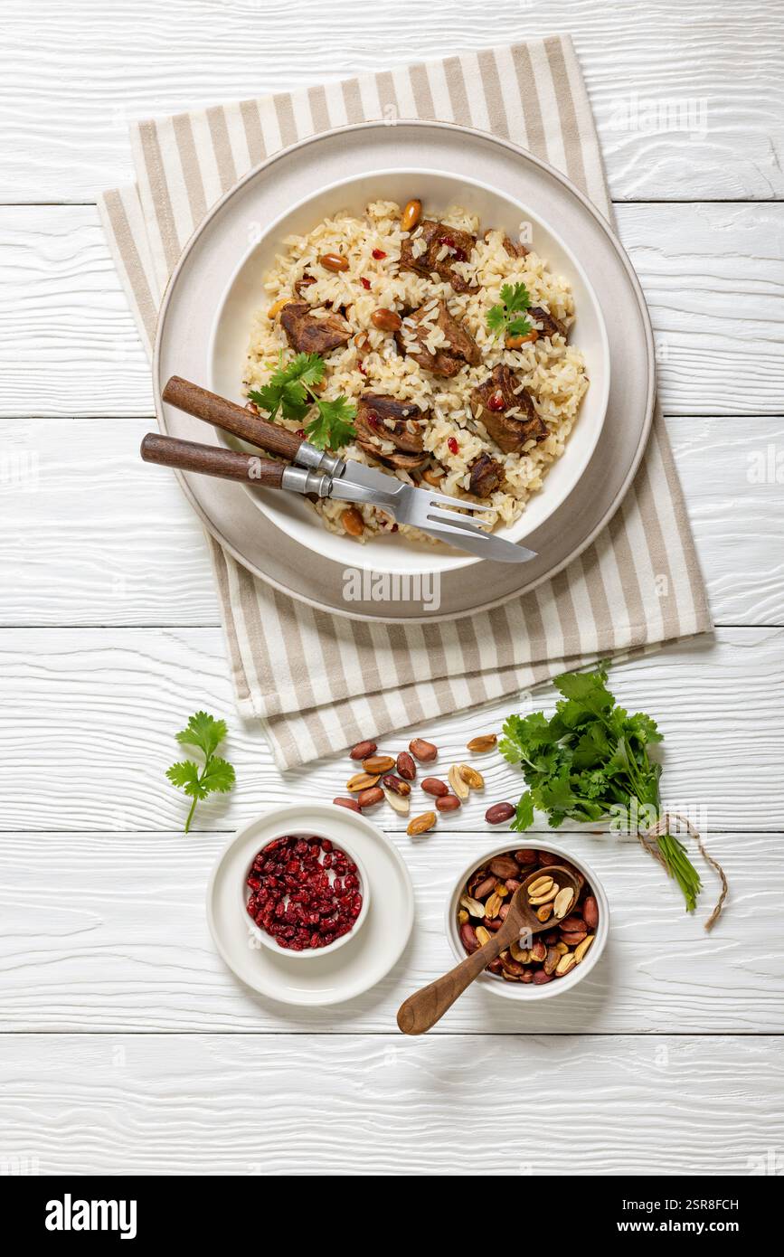 honey-soy beef and peanut rice bowl, beef rice pilaf in a white bowl on ...