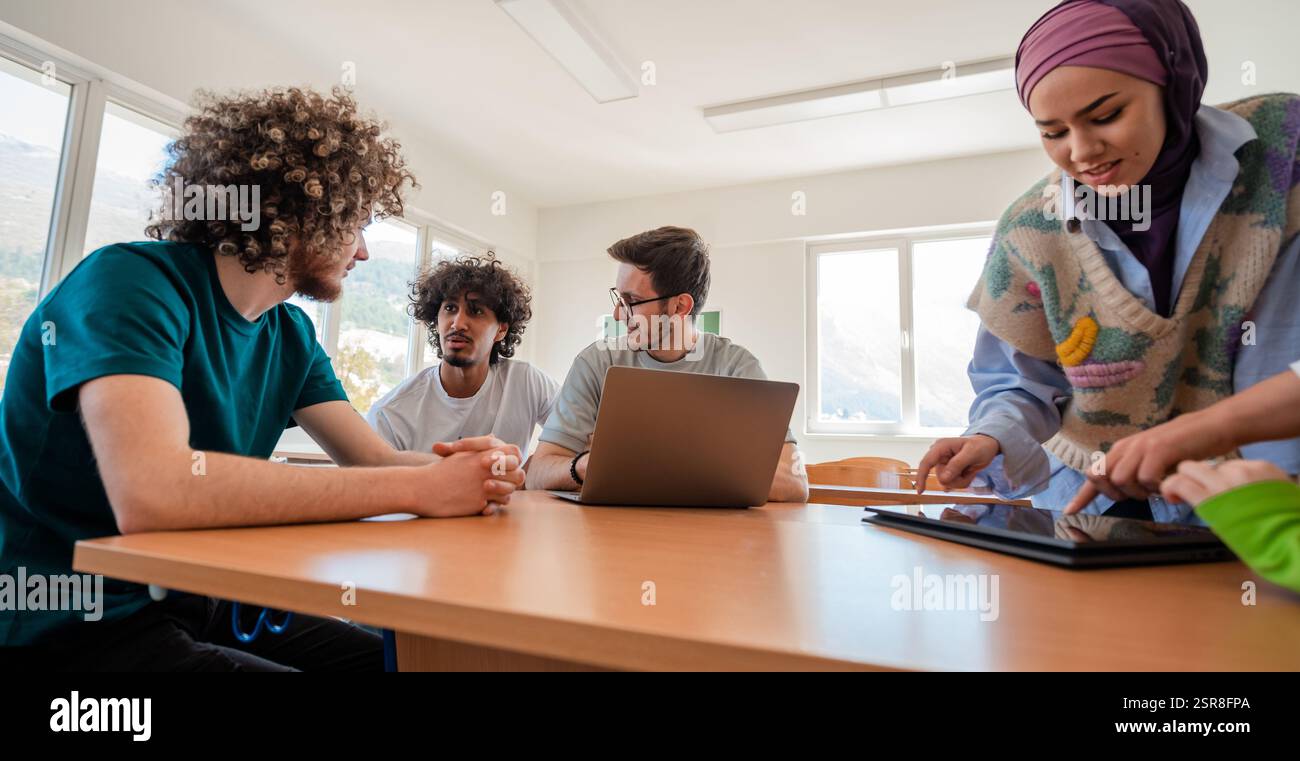A group of diverse college students studying together or a business ...