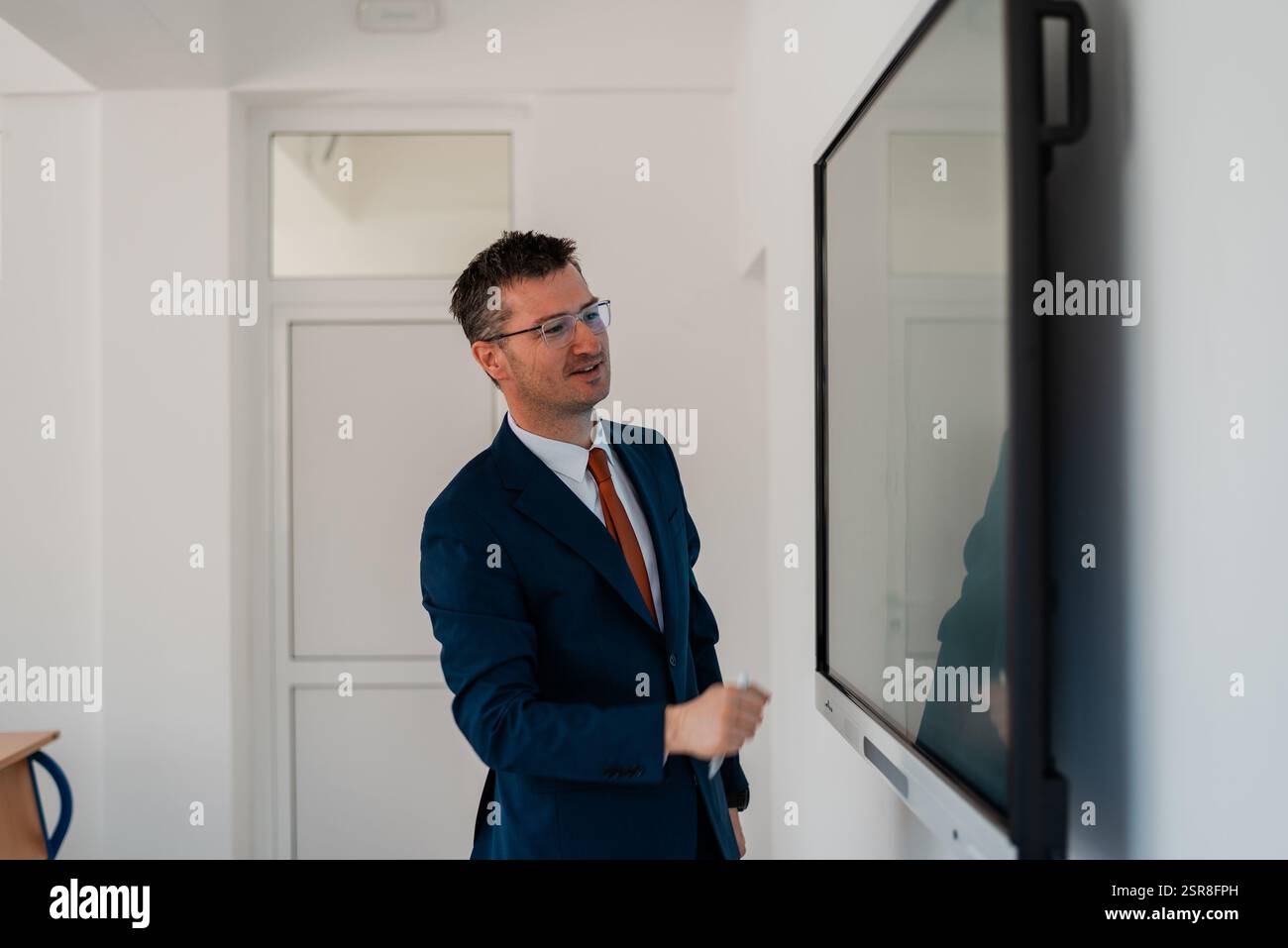 University male teacher giving lecture in the classroom or business man ...