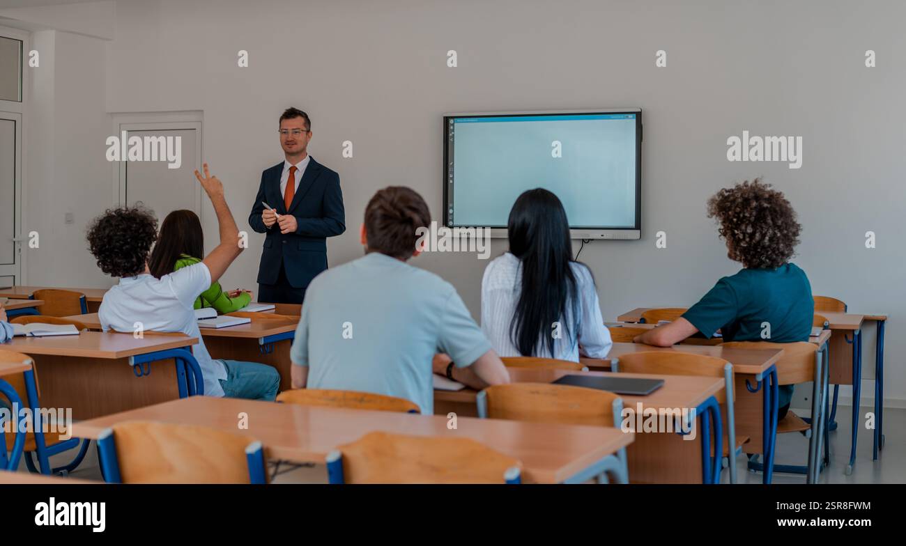 In the classroom group of college students listening to a university ...