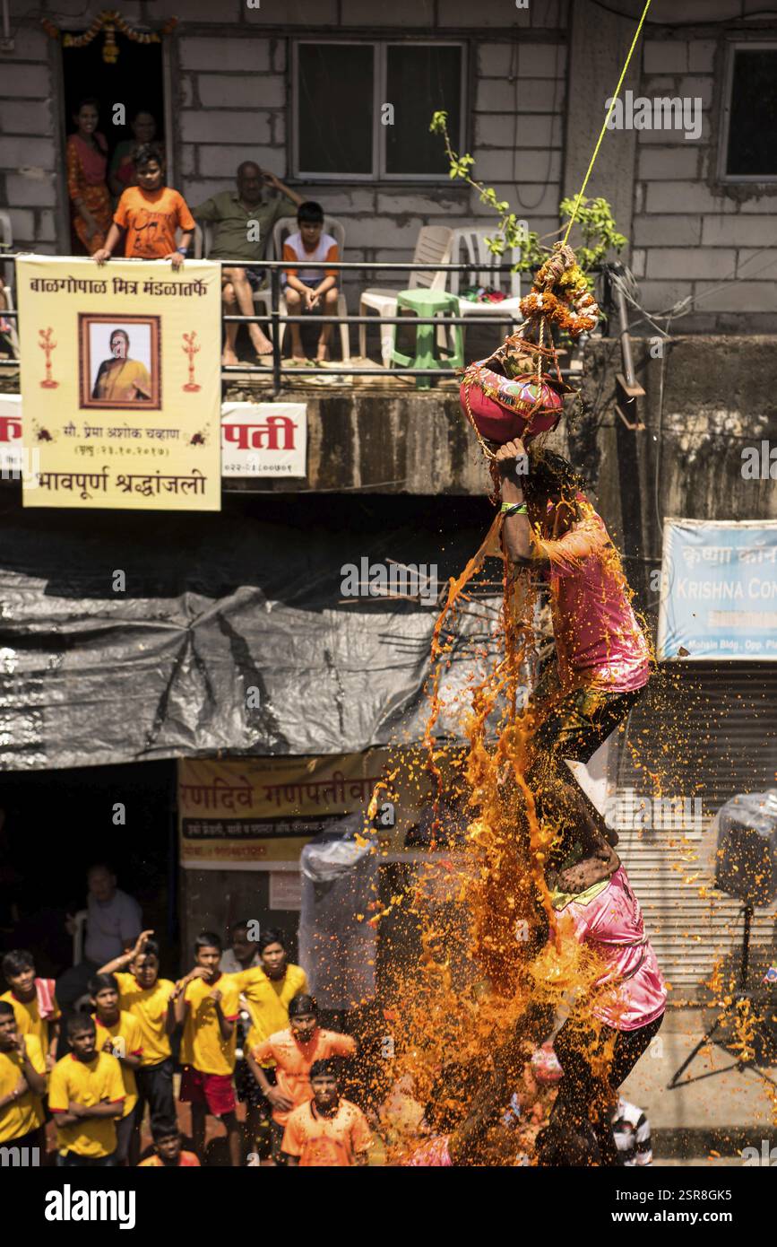 Men human pyramid breaking Dahi Handi, Janmashtami festival, Mumbai ...
