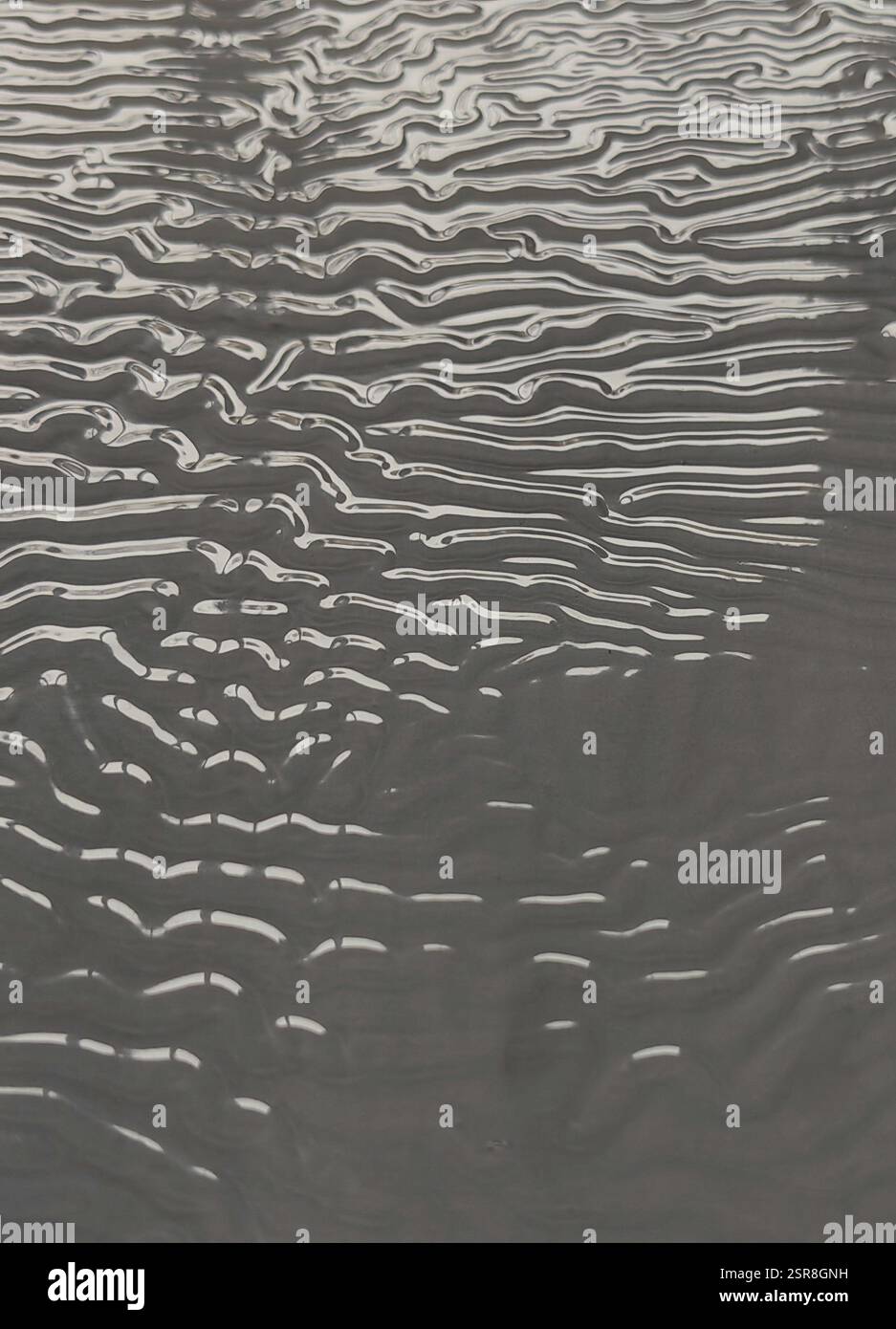 Distorted Reflections – Water Ripples on Plastic Foil Book Cover Stock ...