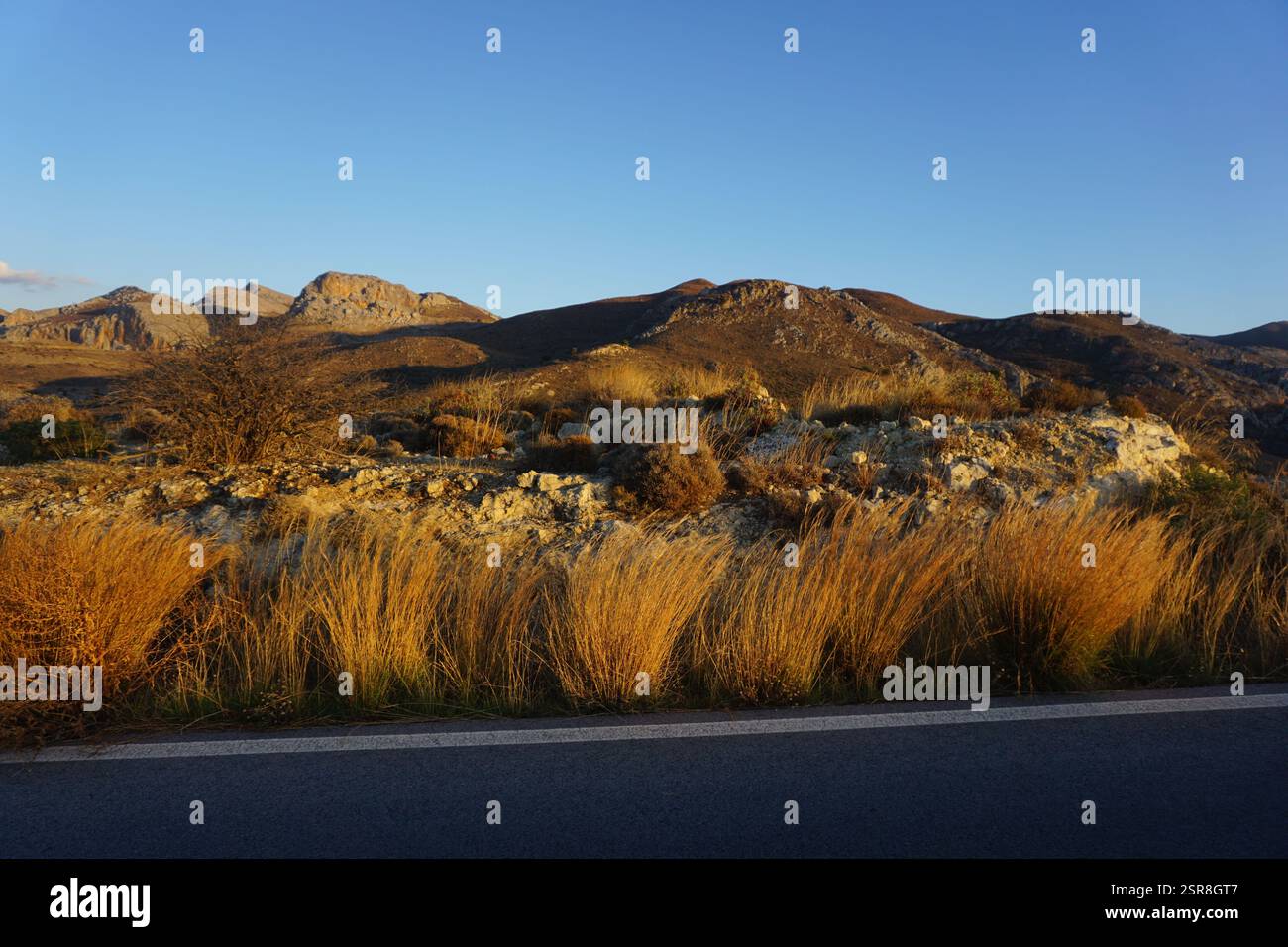 Natural landscape of Crete with a view from the road with golden earth ...