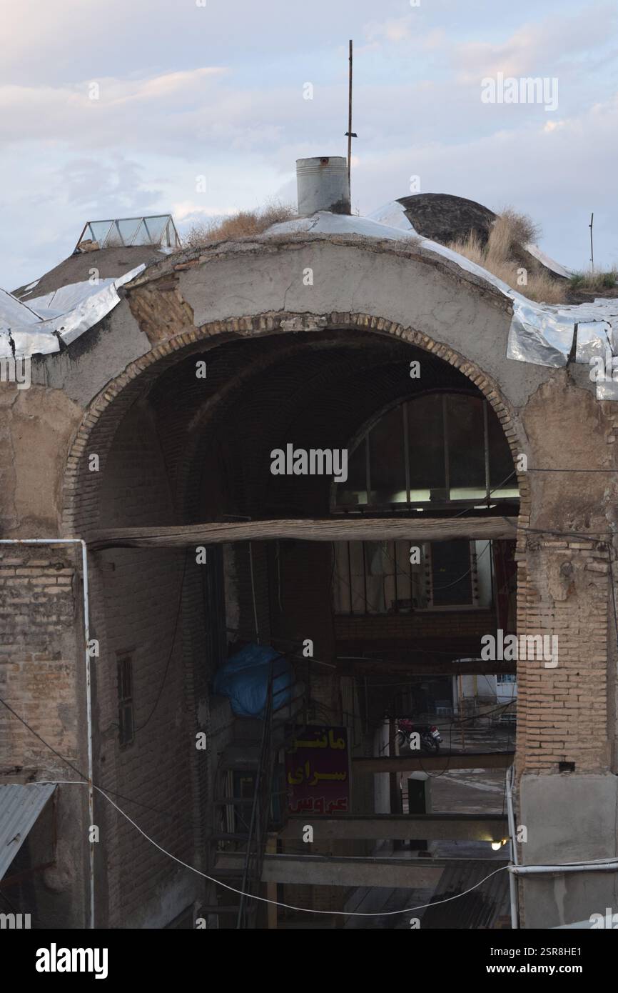 Traditional mud-brick domed house in Iran at sunset, showcasing ...