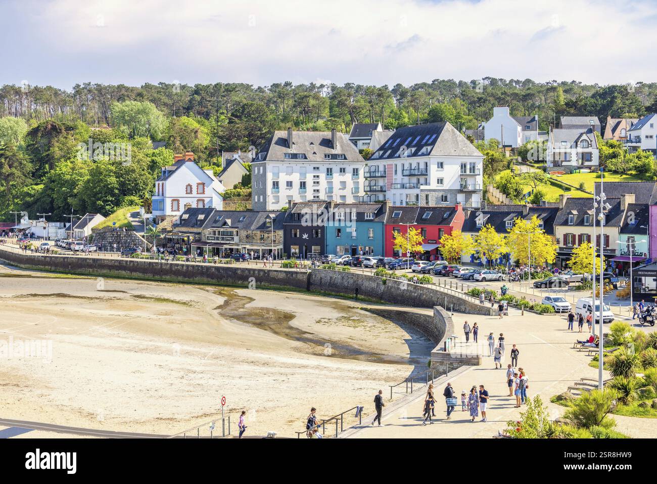 People walking on the beach promenade in a French coastal idyllic ...