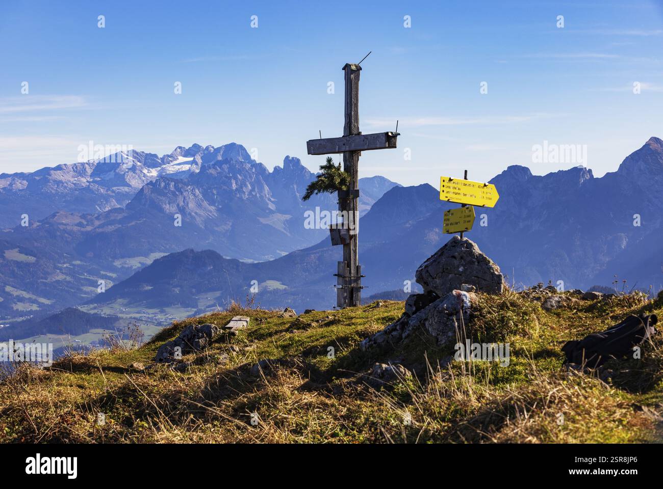 Old summit cross on the Schwarzer Berg with a view of the Dachstein ...