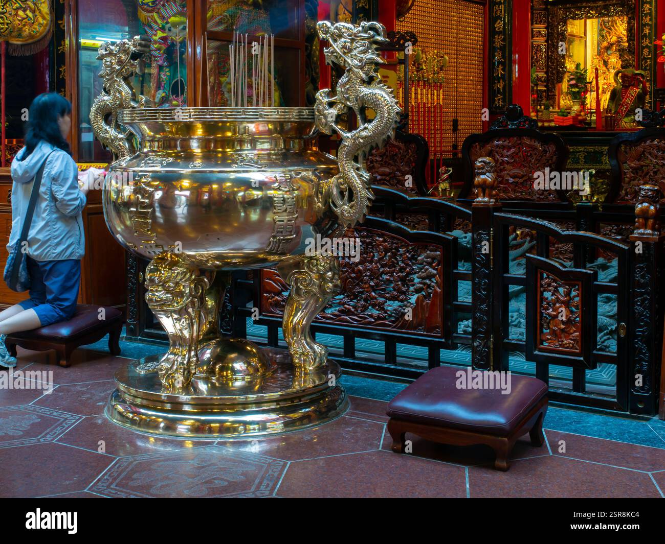 Taipei, Taiwan - October 2016: Golden censer and praying people in a ...