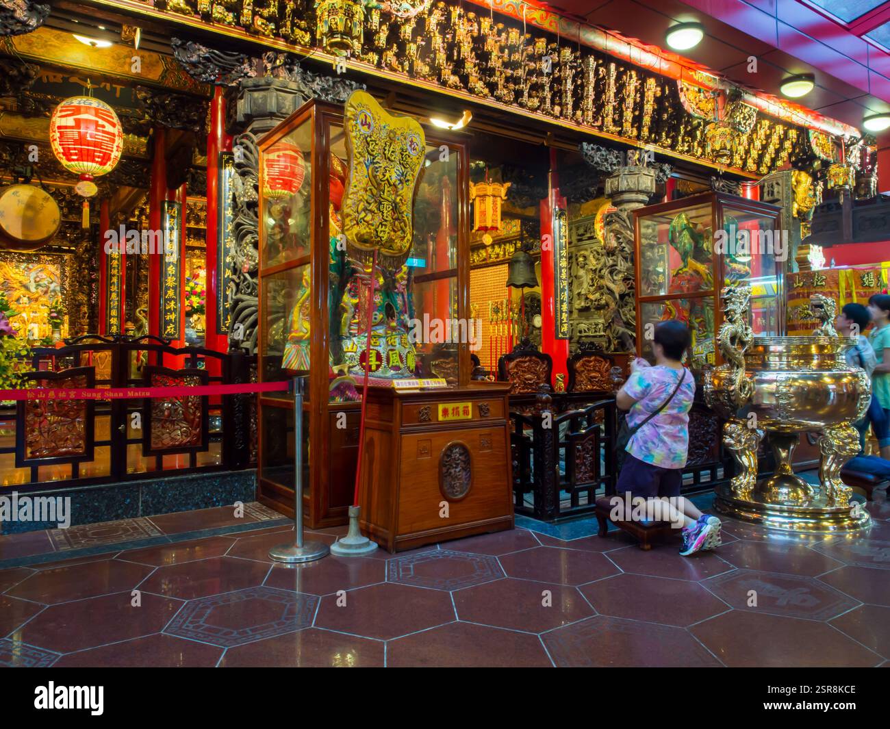 Taipei, Taiwan - October 2016: Golden censer and praying people in a ...