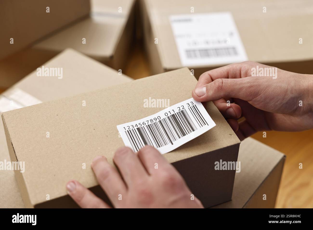 Man sticking shipping label hi-res stock photography and images - Alamy